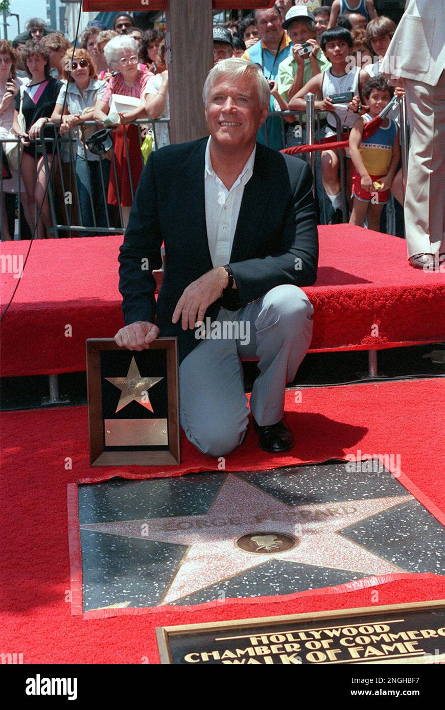 Actor George Peppard poses during a ceremony presenting him with a Star ...