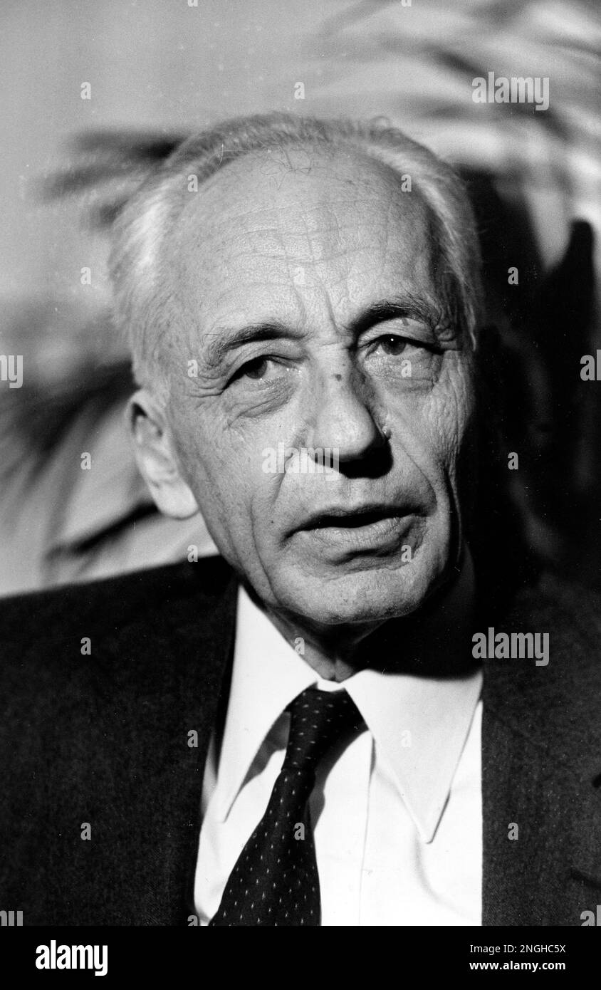 Jean Dausset, 63, talks with reporters at his apartment after getting ...