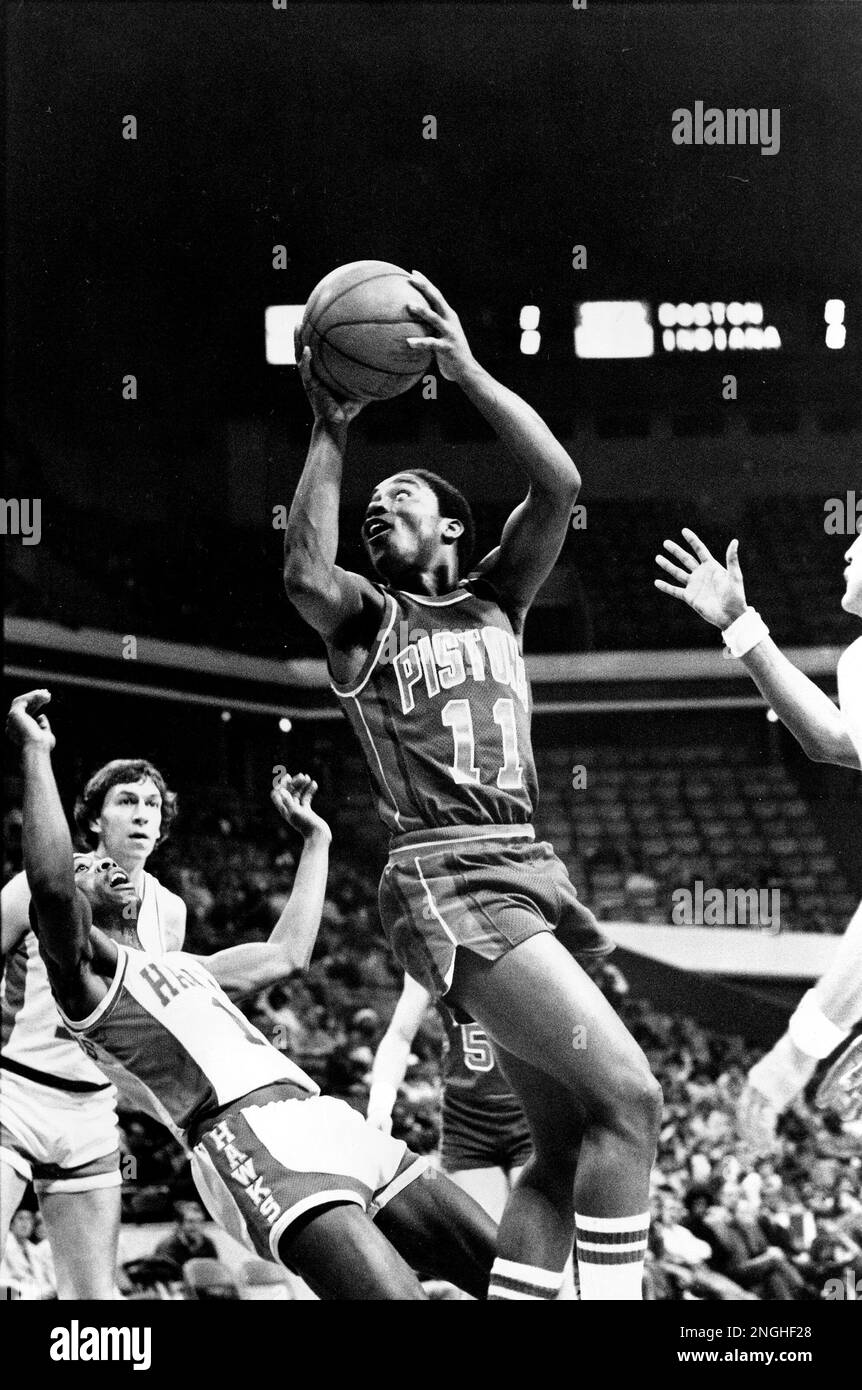 Detroit Pistons guard Isiah Thomas (11) goes up, twists and shoots for ...