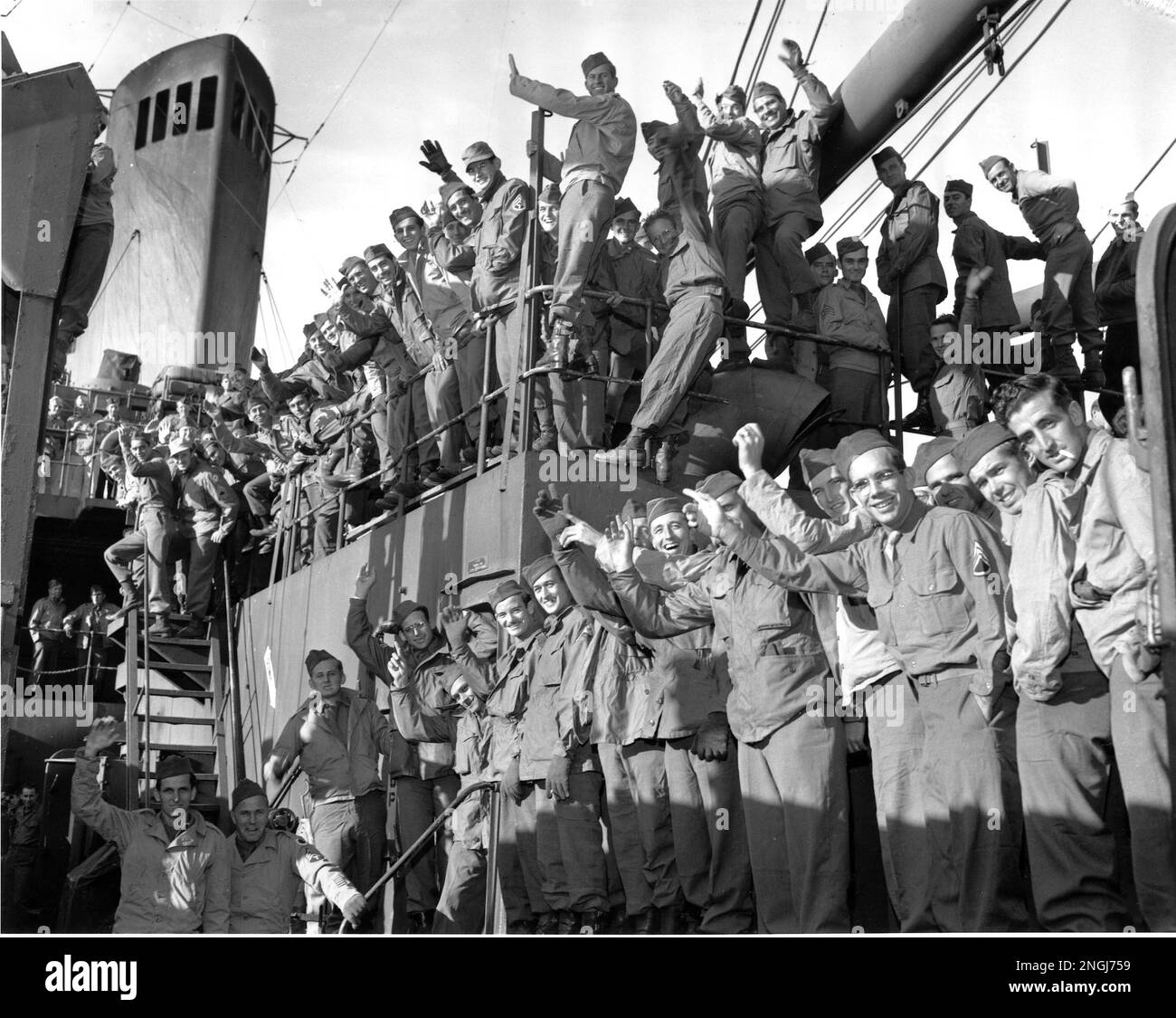 Soldiers of the 37th (Buckeye) Division wave from the deck of the USS ...