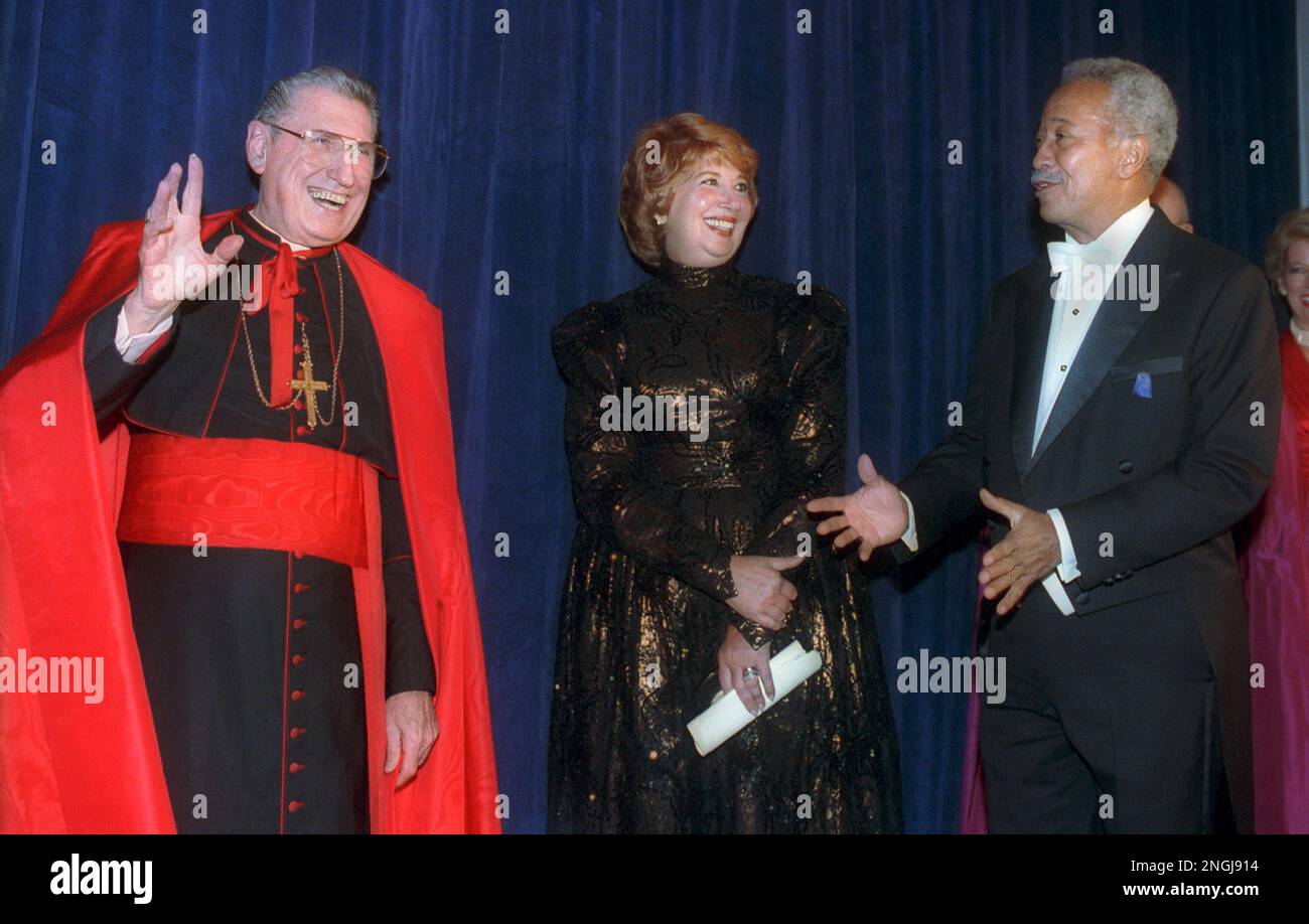 Cardinal John J. O'Connor, left, waves as former New York City Opera ...