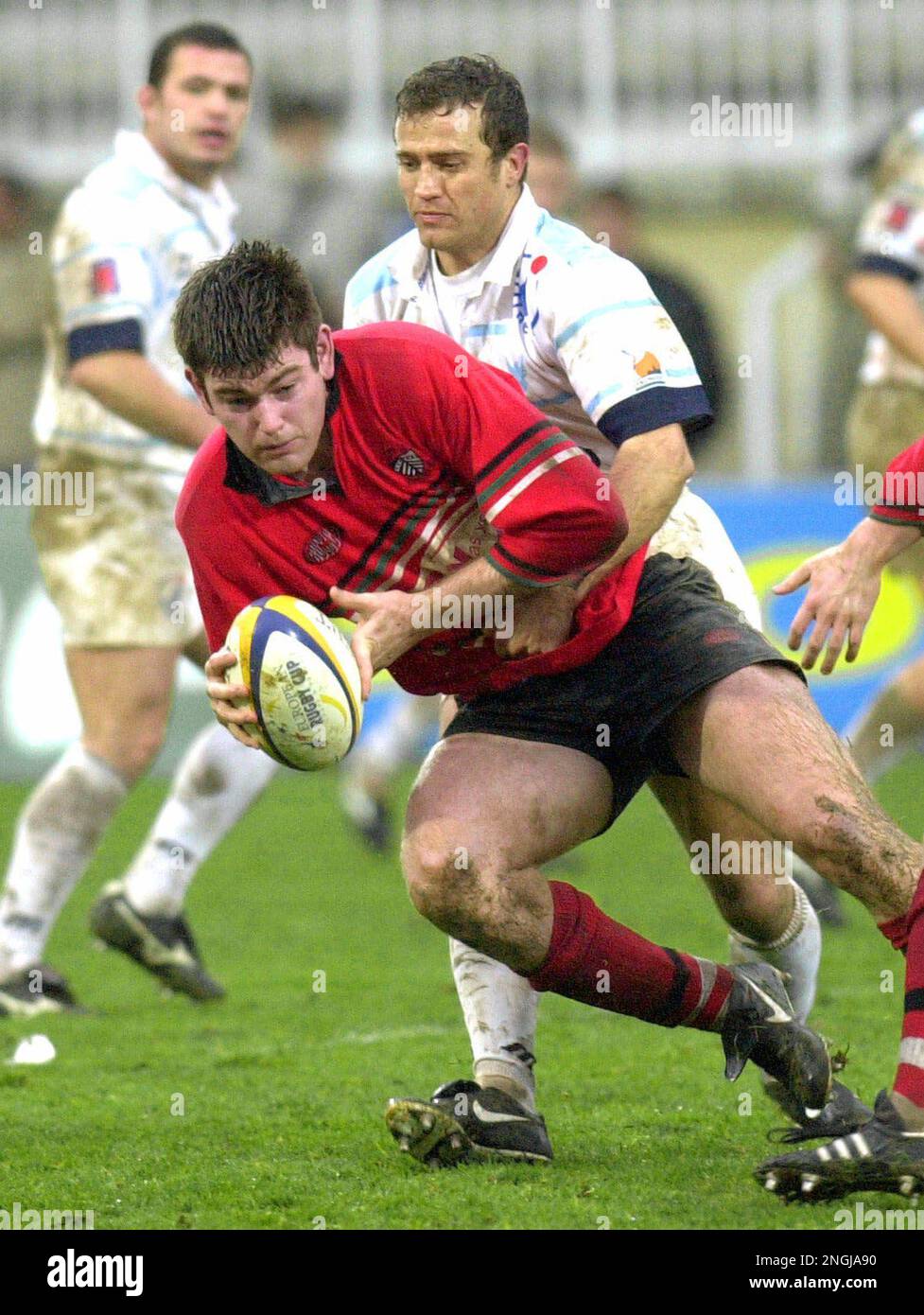 Rory Greenslade-Jones of Pontypridd, with the ball, tries to escape ...