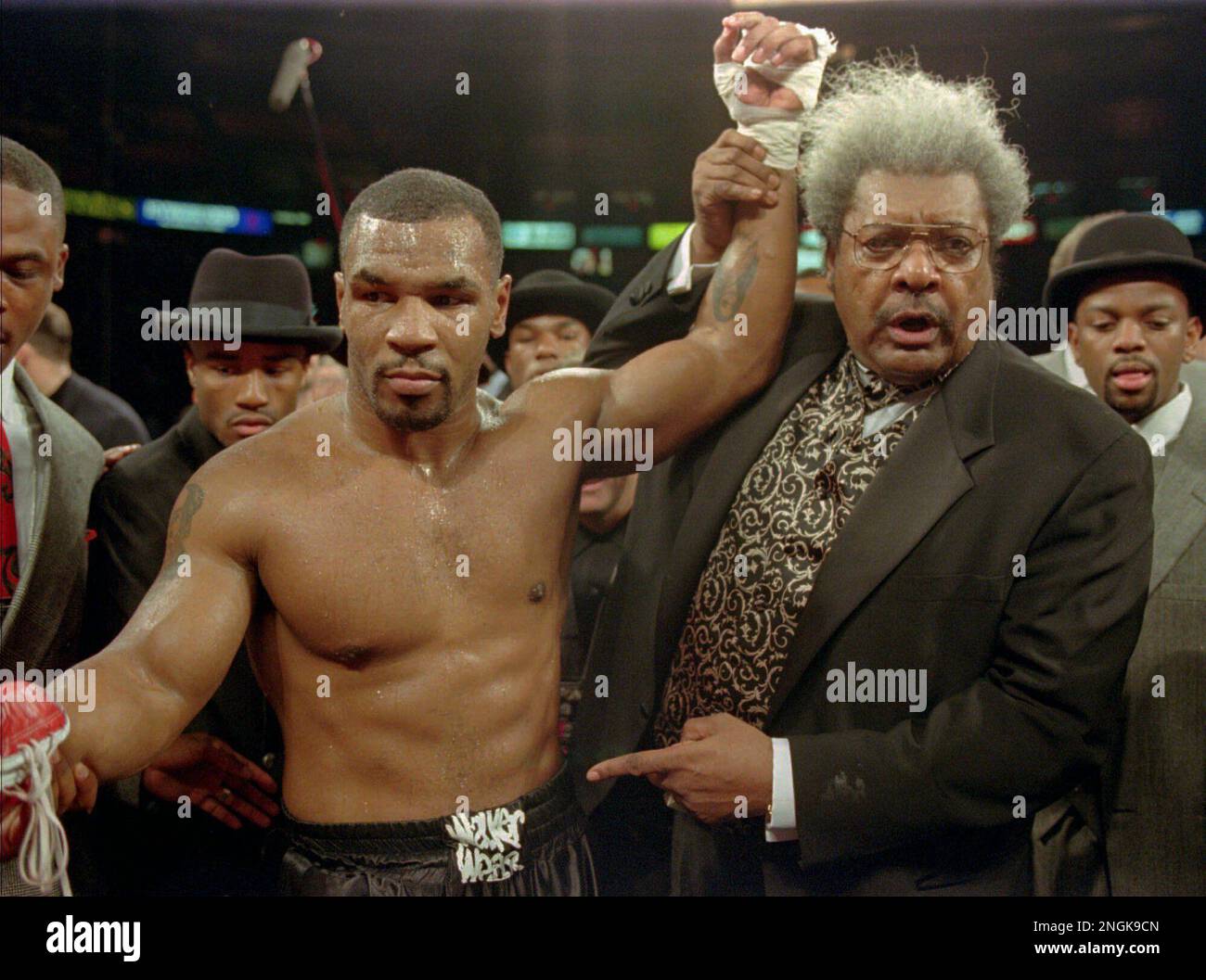Mike Tyson, left, and boxing promoter Don King celebrate Tyson's ...