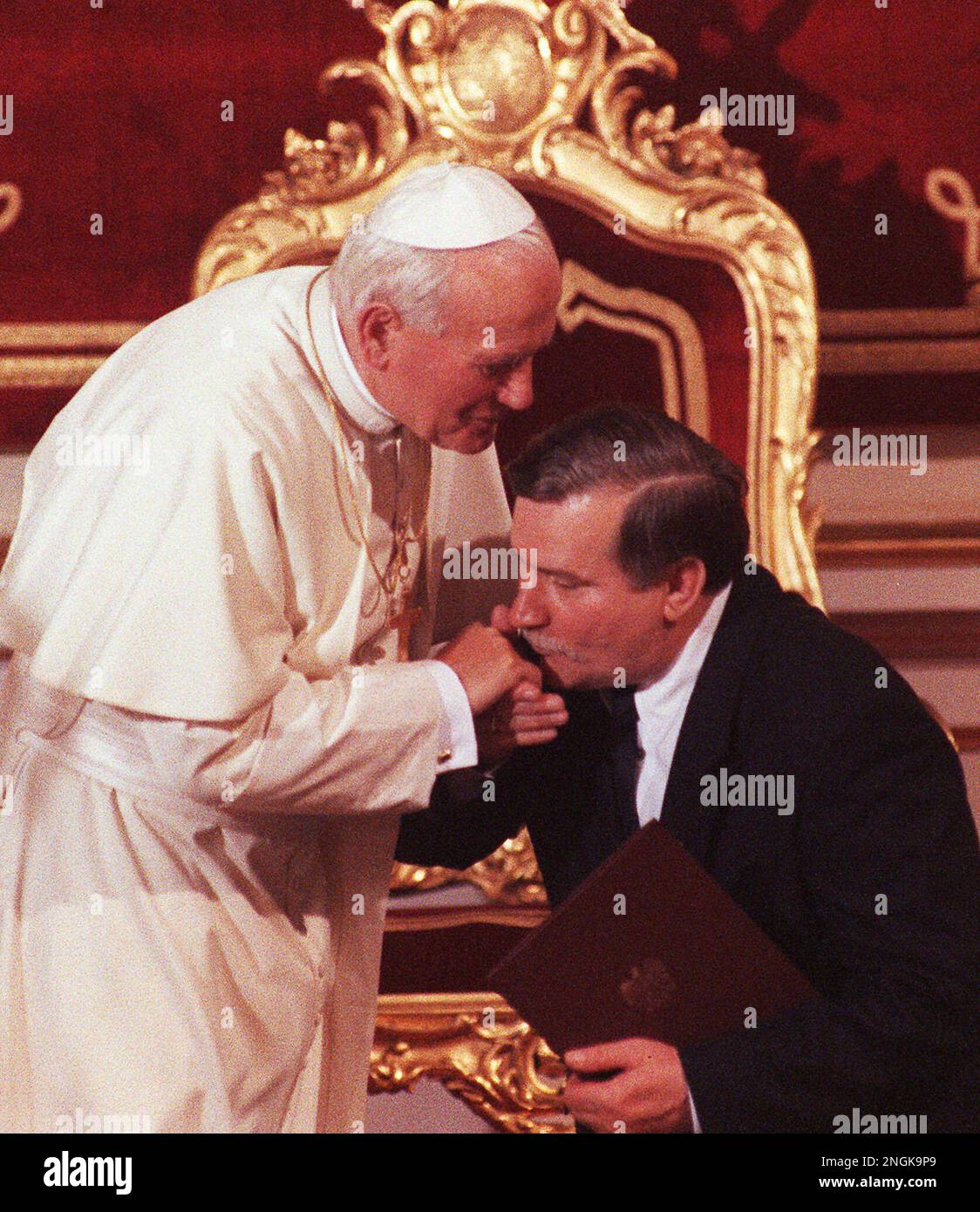 FILE---Poland's President Lech Walesa kisses the hand of Polish Pope John Paul II in this June 8 ...