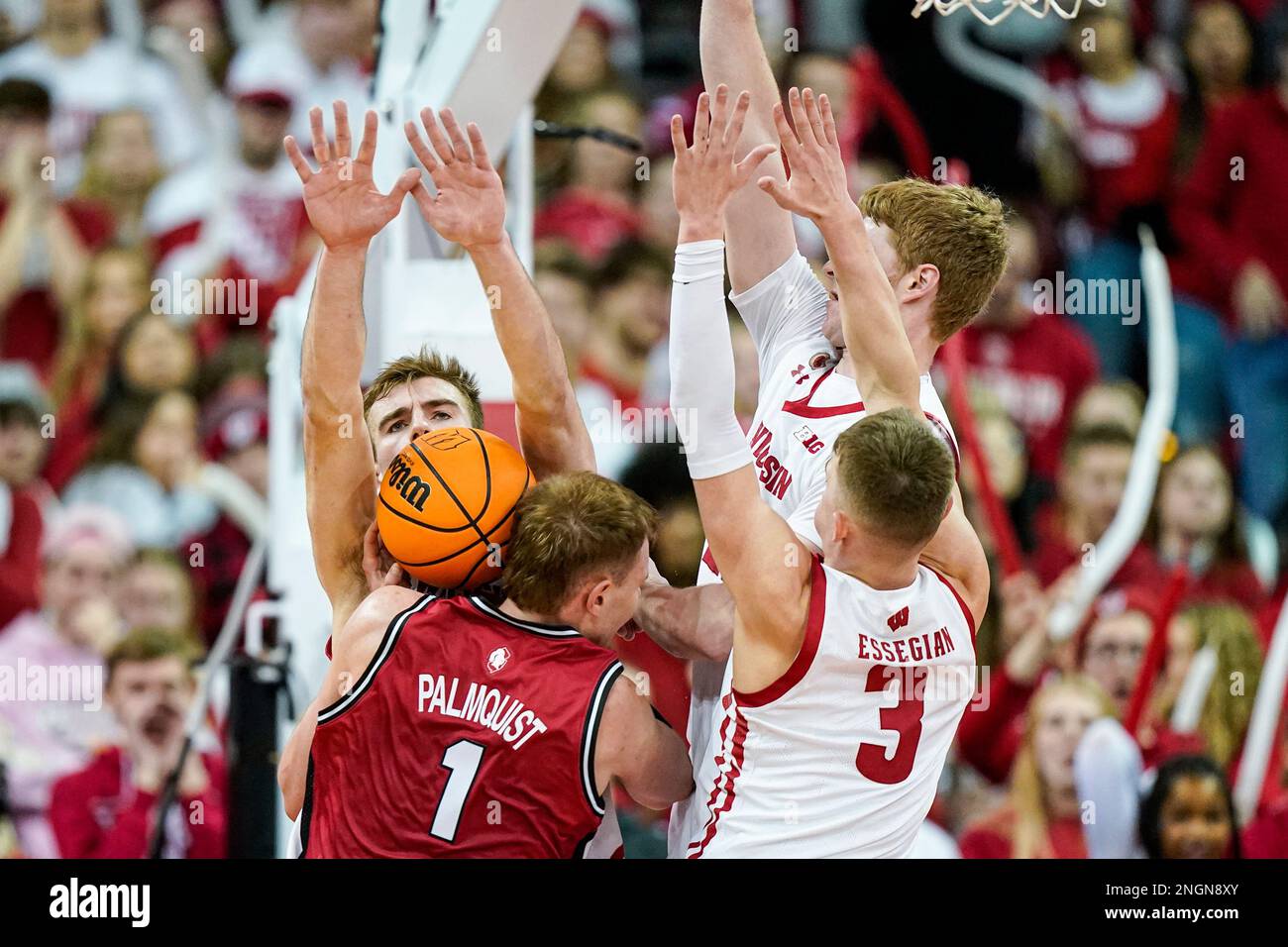 Rutgers' Oskar Palmquist (1) drives against Wisconsin's Tyler Wahl ...