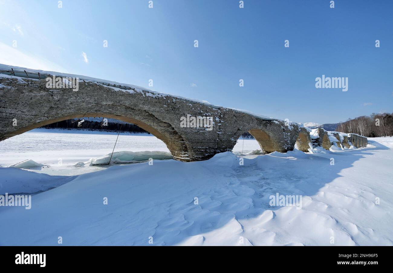 The "Taushubetsu River Bridge" appears over frozen Lake Nukabira in ...