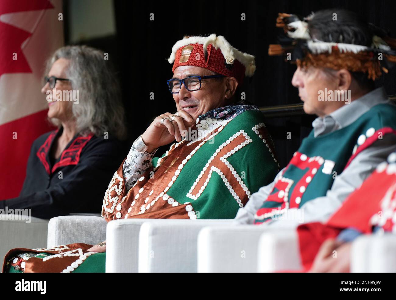Chief John Powell, center, of the Mamalilikulla First Nation, sits with ...