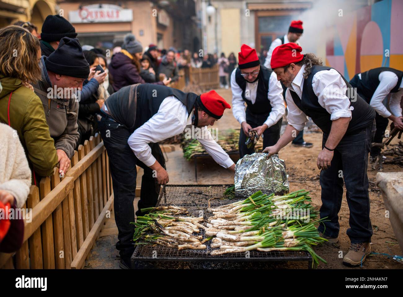 Bunches of calçots are roasted in the brassa during the Calçotada ...