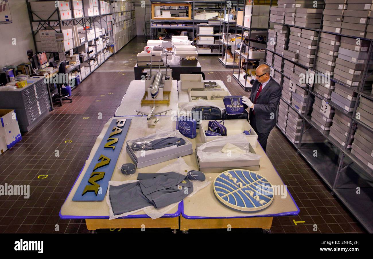 Curator and assistant director of aviation, John Hill diplays a few Pan ...