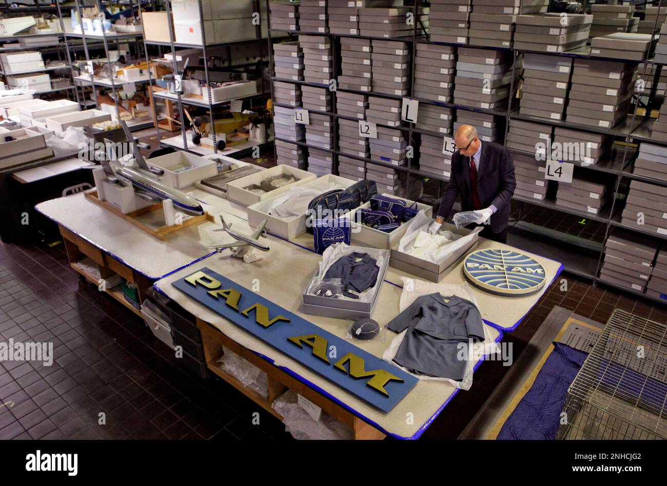 Curator and assistant director of aviation, John Hill diplays a few Pan ...