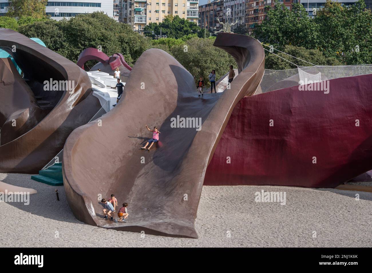 Children go down the slide at the Gulliver park in Valencia's Jardín ...