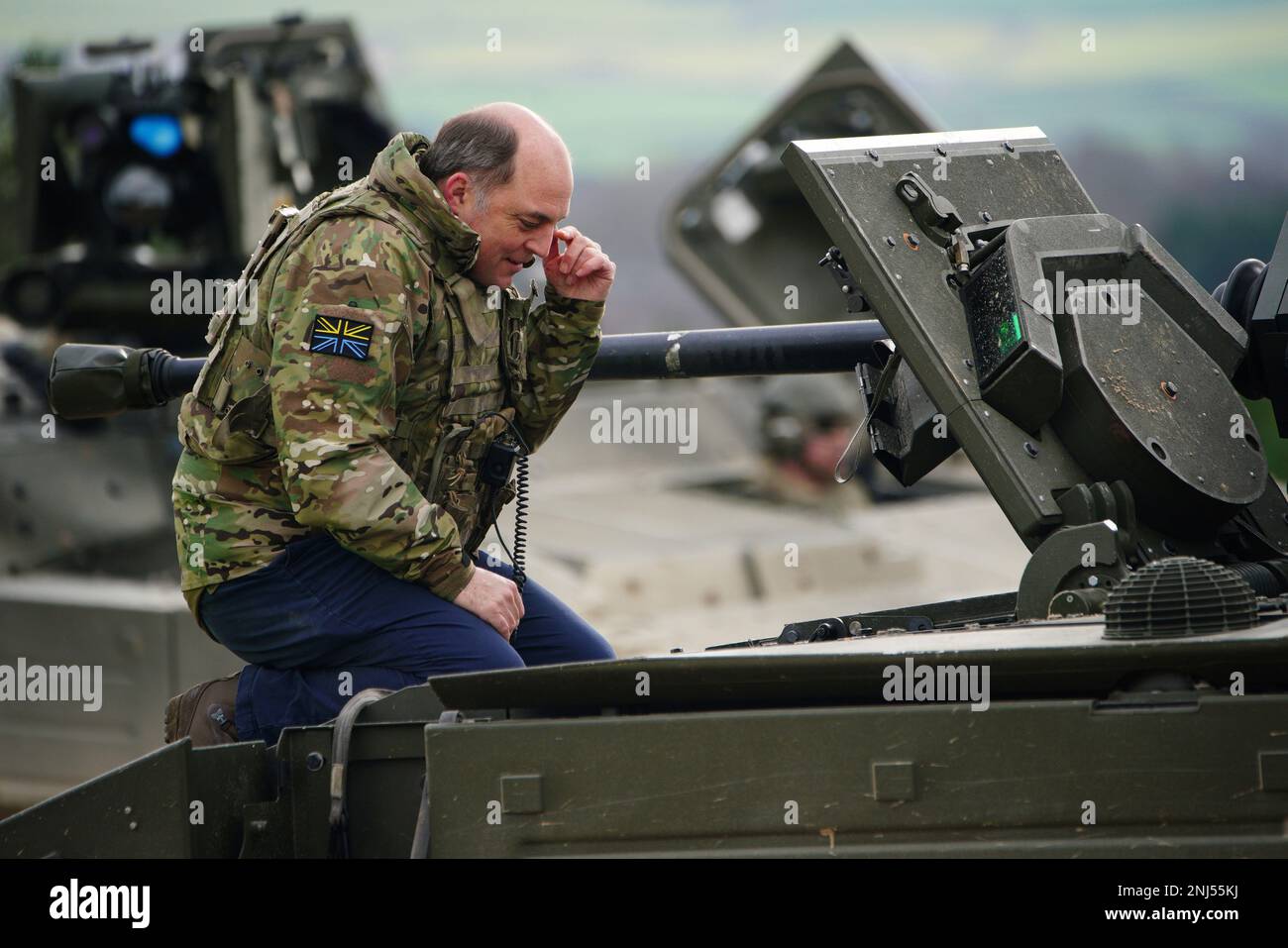 Britain's Defence Secretary Ben Wallace speaks to the crew inside an ...