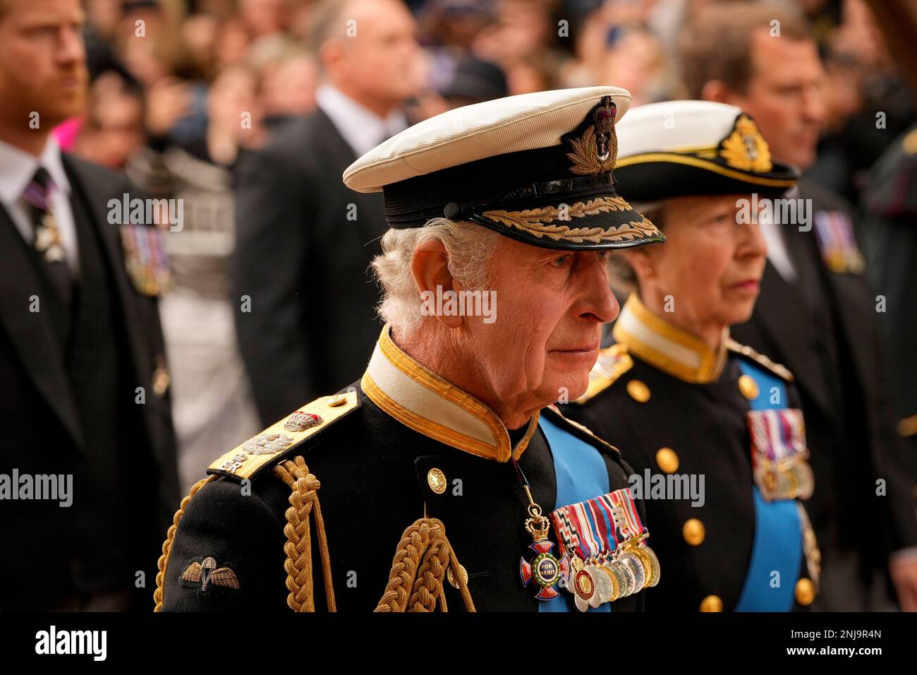 Britain's King Charles III, front, and Princess Anne follow the coffin ...