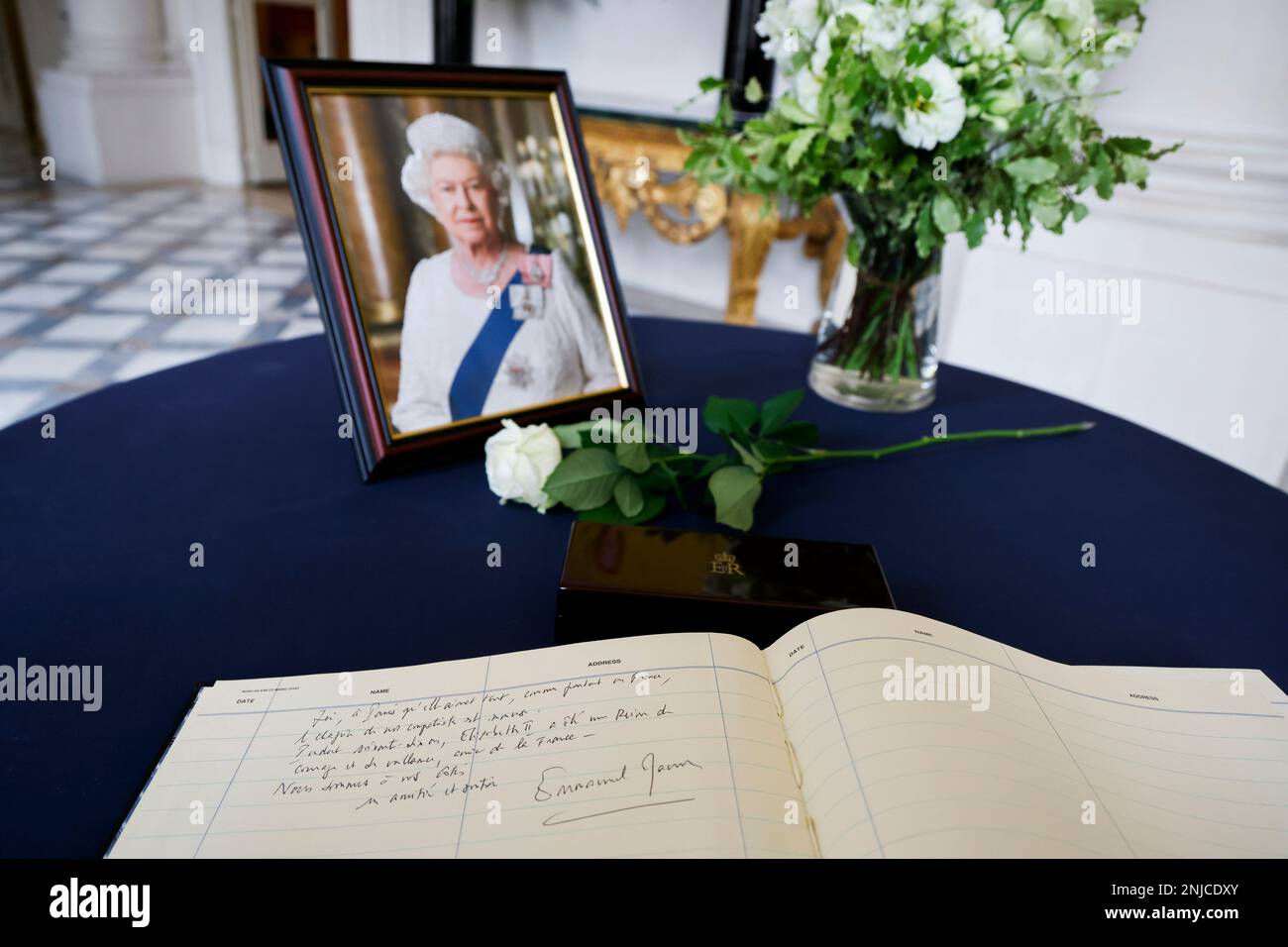 A white rose and a message left by French President Emmanuel Macron in ...