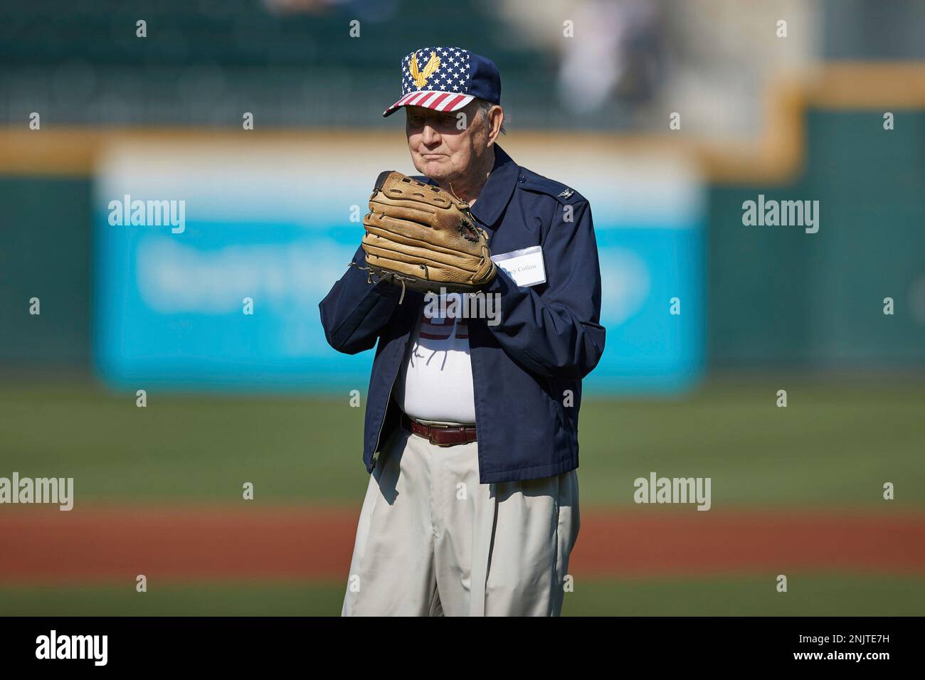 Colonel James Quincy Collins Jr. prepares to throw out the ceremonial ...