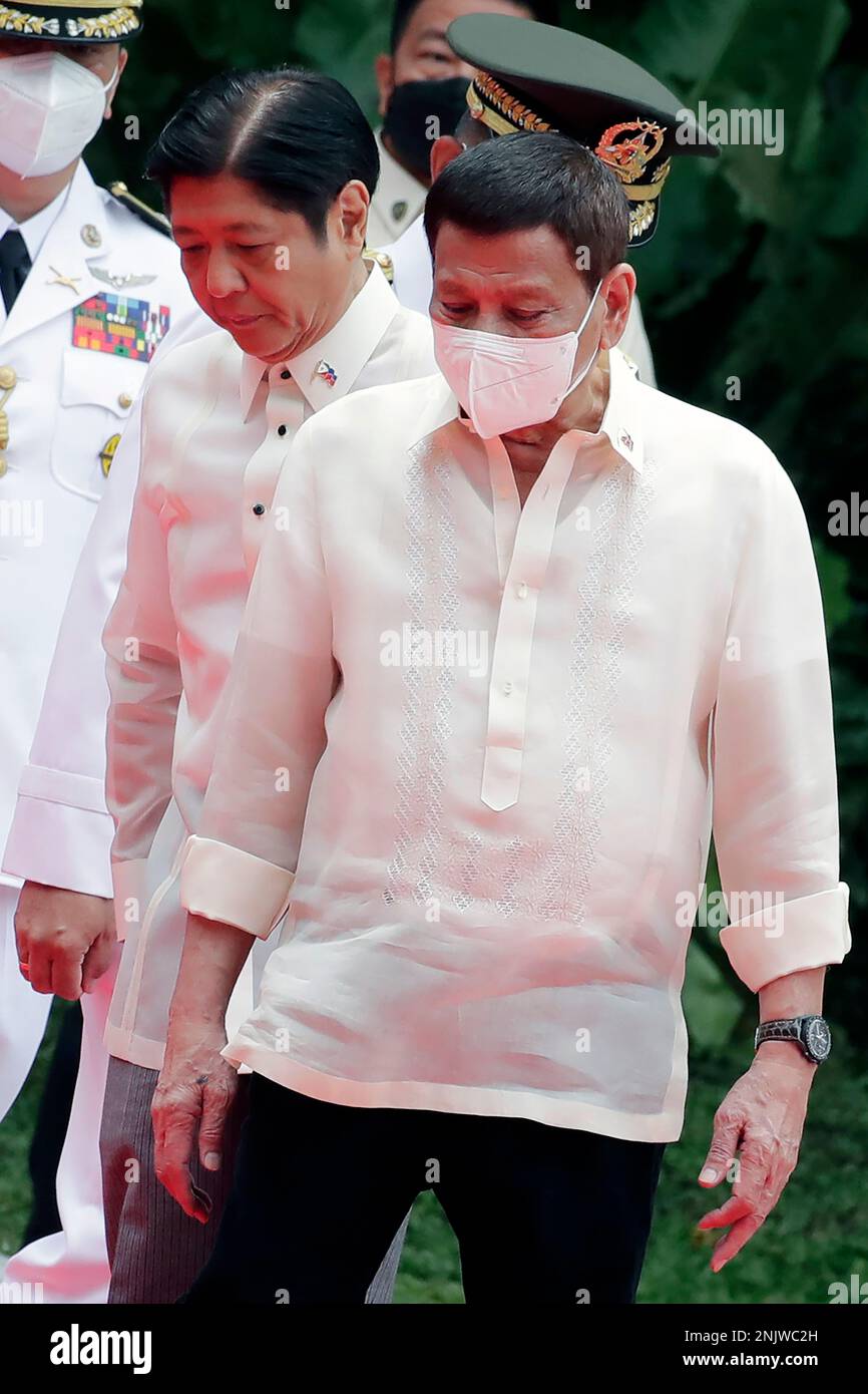 Incoming Philippine president Ferdinand Marcos Jr., left, and outgoing ...