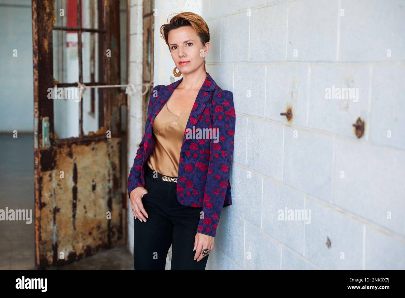 Journalist and artist Sarah Shourd stands for a portrait in a building ...