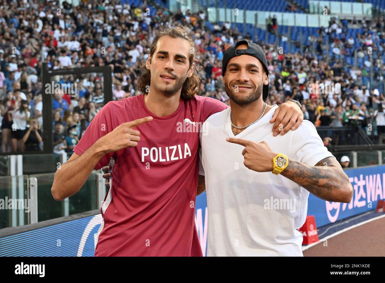 Marcell Jacobs, right, and Gianmarco Tamberi pose for photographers at ...