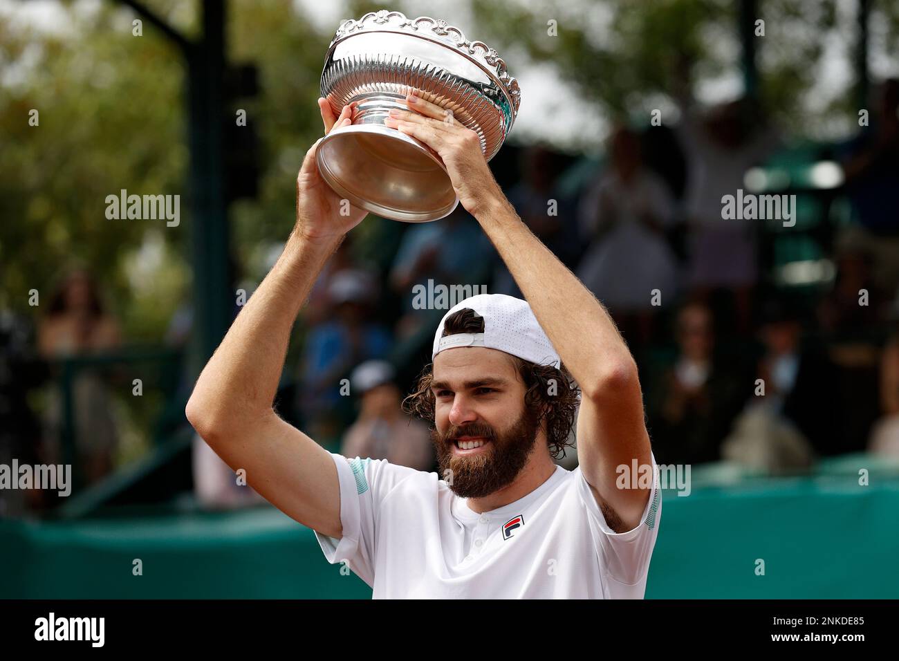 Reilly Opelka, of the United States, holds the trophy up after ...