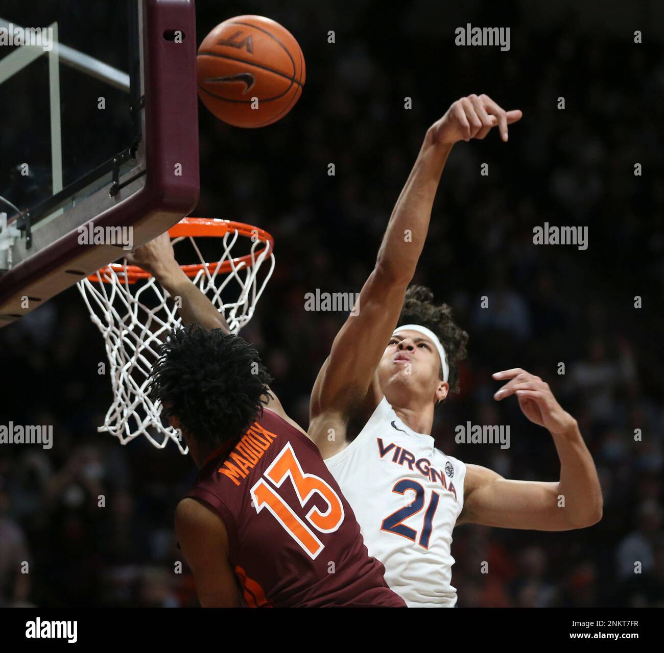 Virginia Tech's Darius Maddox (13) has his shot blocked by Virginia's ...