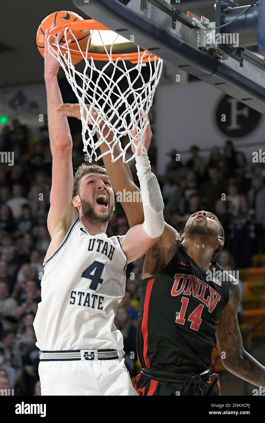 Utah State forward Brandon Horvath (4) is fouled by UNLV forward Royce ...