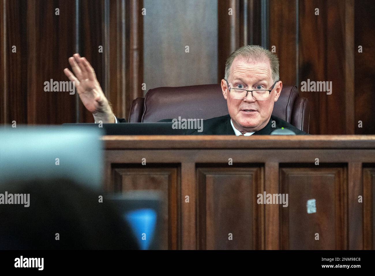Superior Court Judge Timothy Walmsley speaks with attorney's before the ...