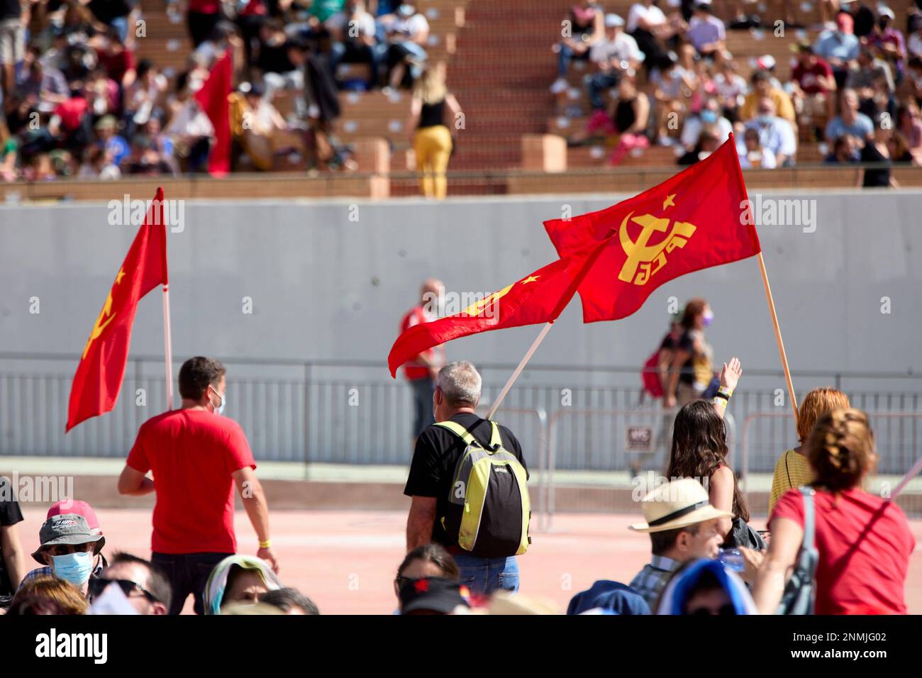 People hold PCE flags at the PCE centenary party on 25 September 2021 ...