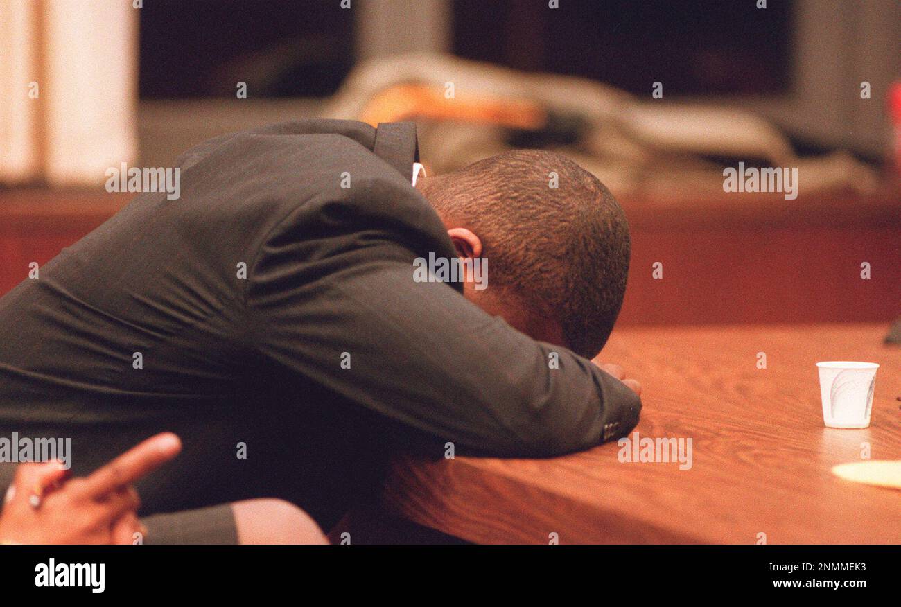 Raynard Cook put his head down onto the defense table Friday evening ...