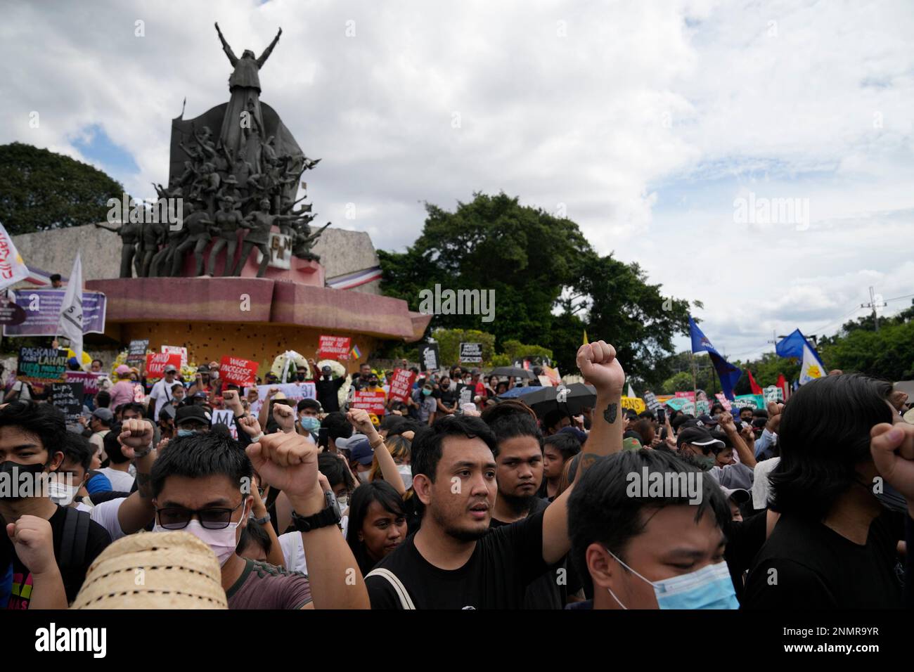 Protesters chant slogans during a rally to observe the 37th anniversary ...