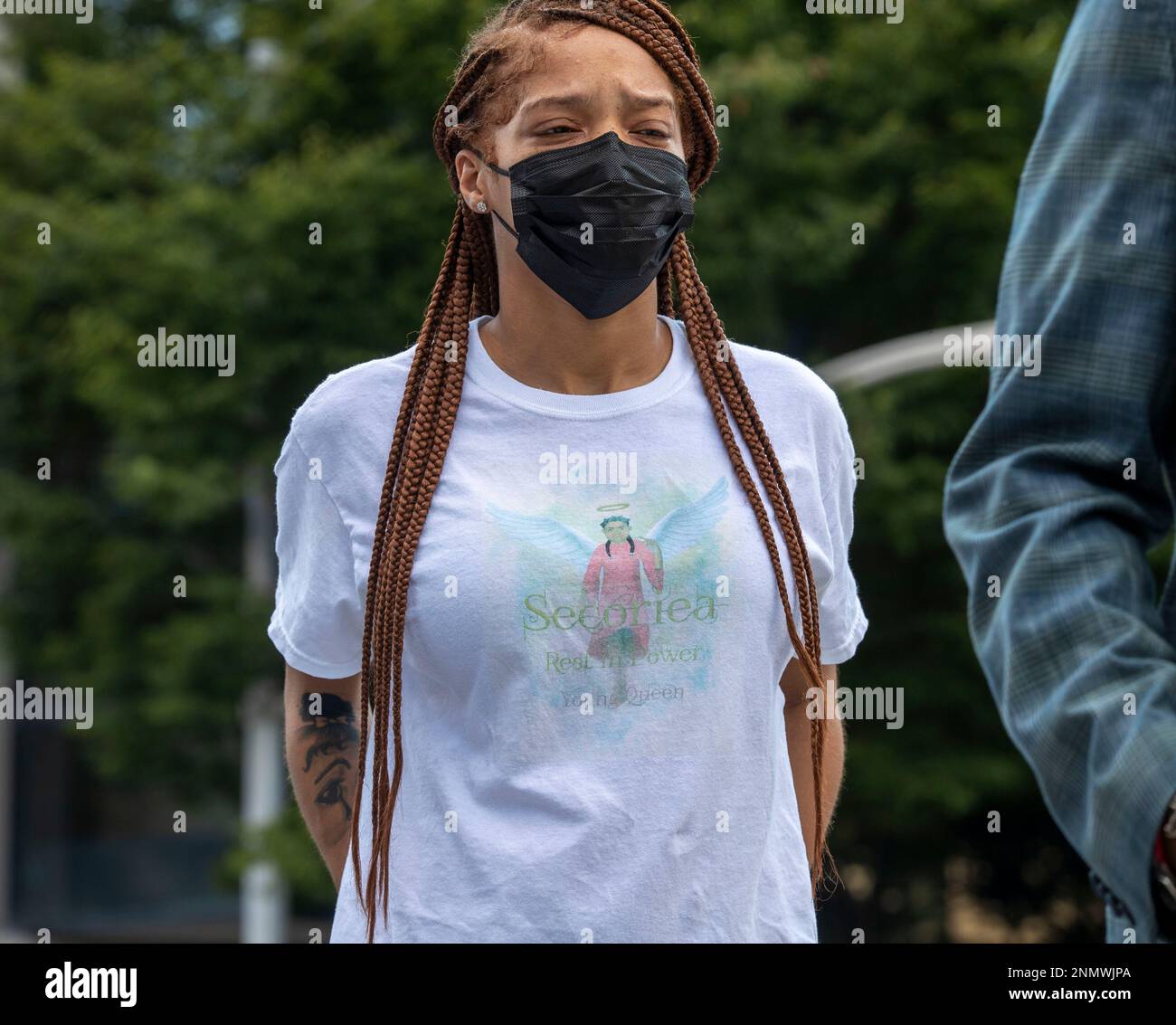 Charmaine Turner wears a T-shirt featuring an image of her late ...