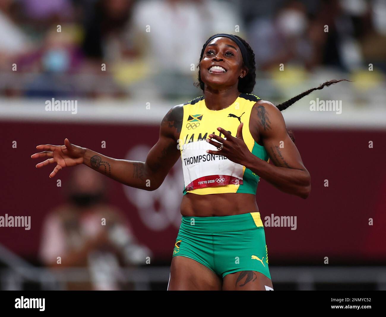 THOMPSON-HERAH Elaine of Jamaica reacts after winning Athletics women's ...