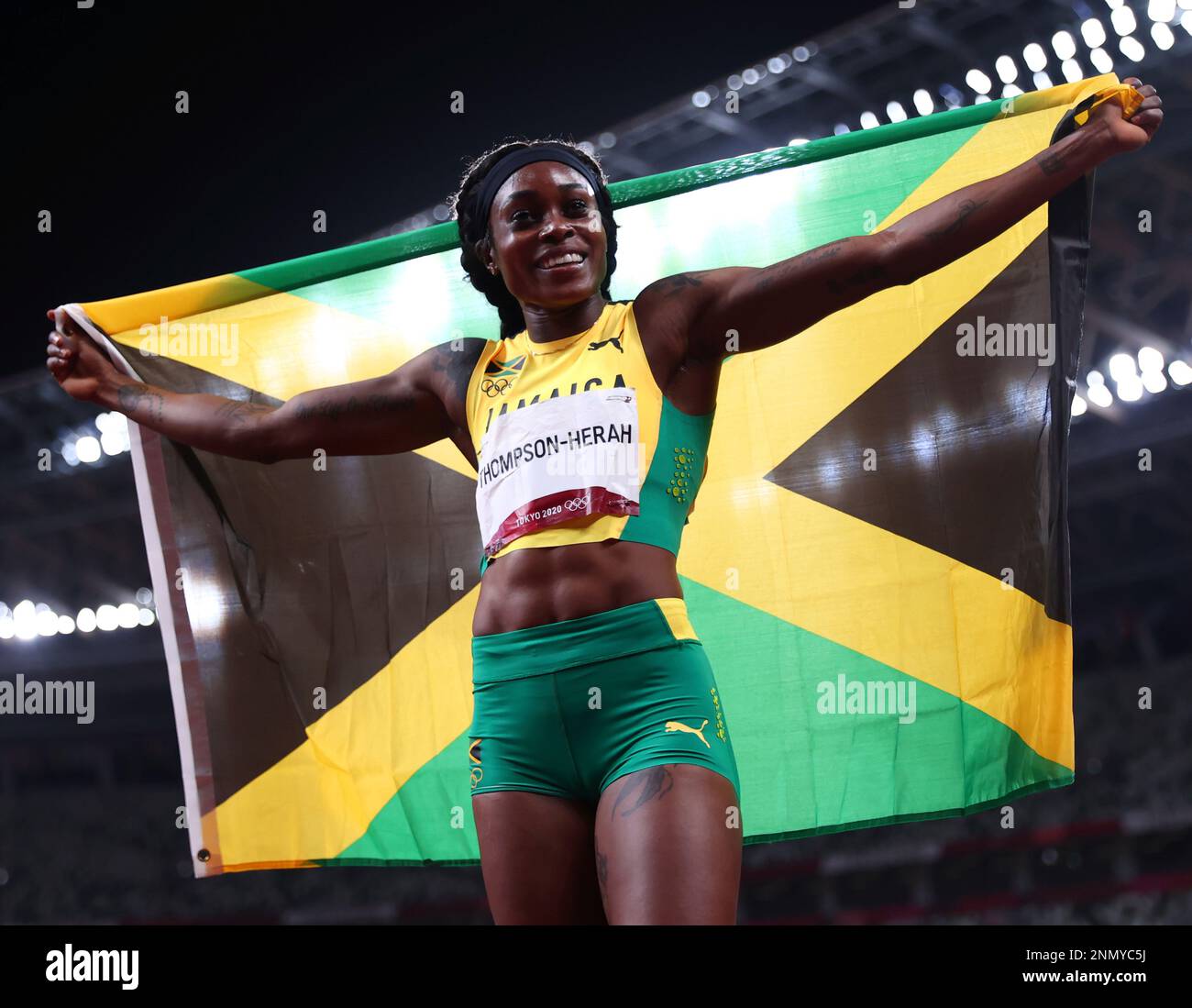 THOMPSON-HERAH Elaine of Jamaica reacts after winning Athletics women's ...