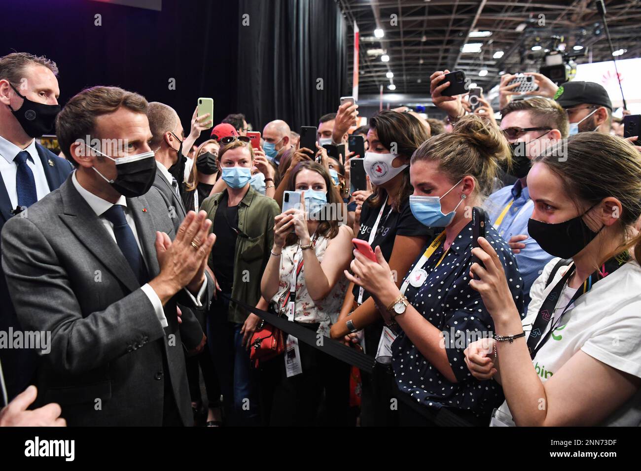 French President Emmanuel Macron greets bystanders at the VivaTech ...