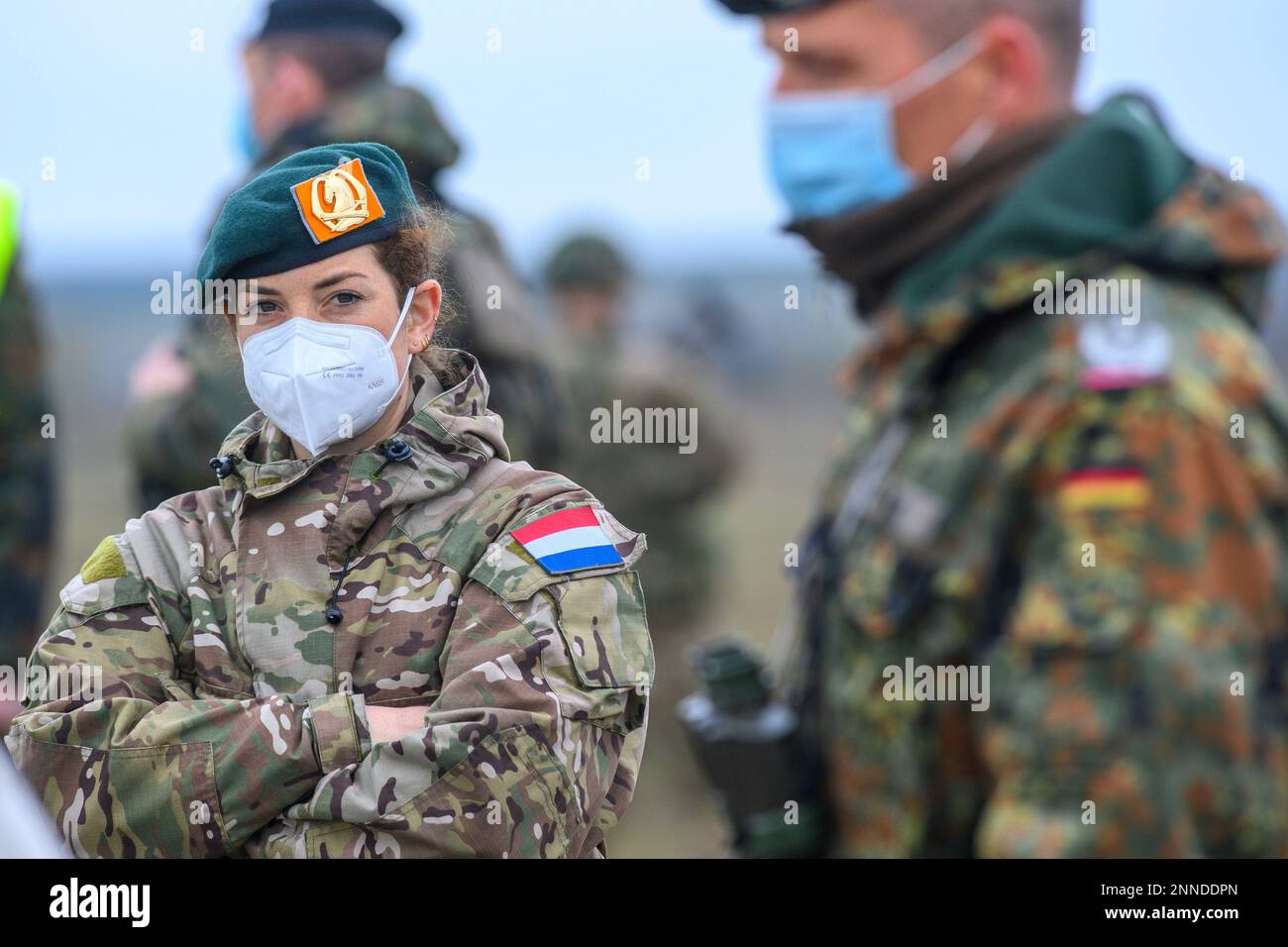 A Dutch officer and a German officer from Tank Battalion 414 stand next ...