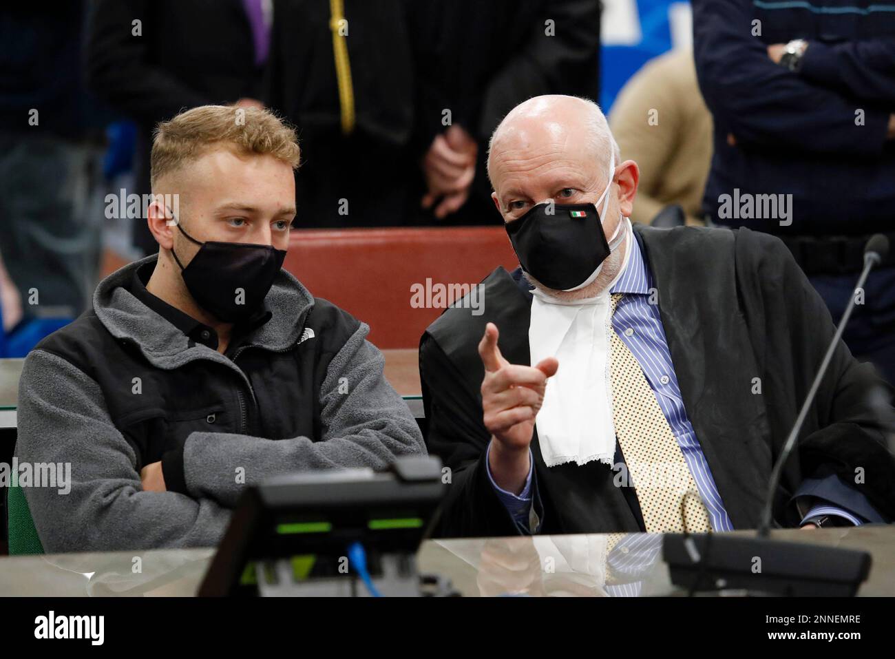 Finnegan Lee Elder, from the United States, left, listens to his lawyer ...
