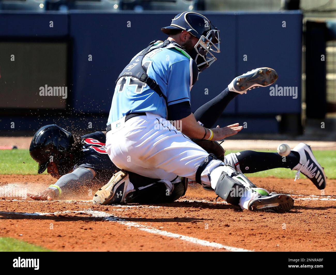 Atlanta Braves outfielder Justin Dean scores past Tampa Bay Rays ...