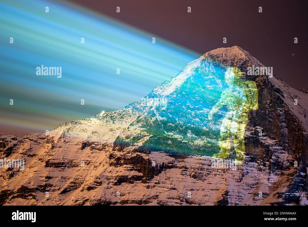 A giant projection of an astronaut on the north face of the Eiger ...