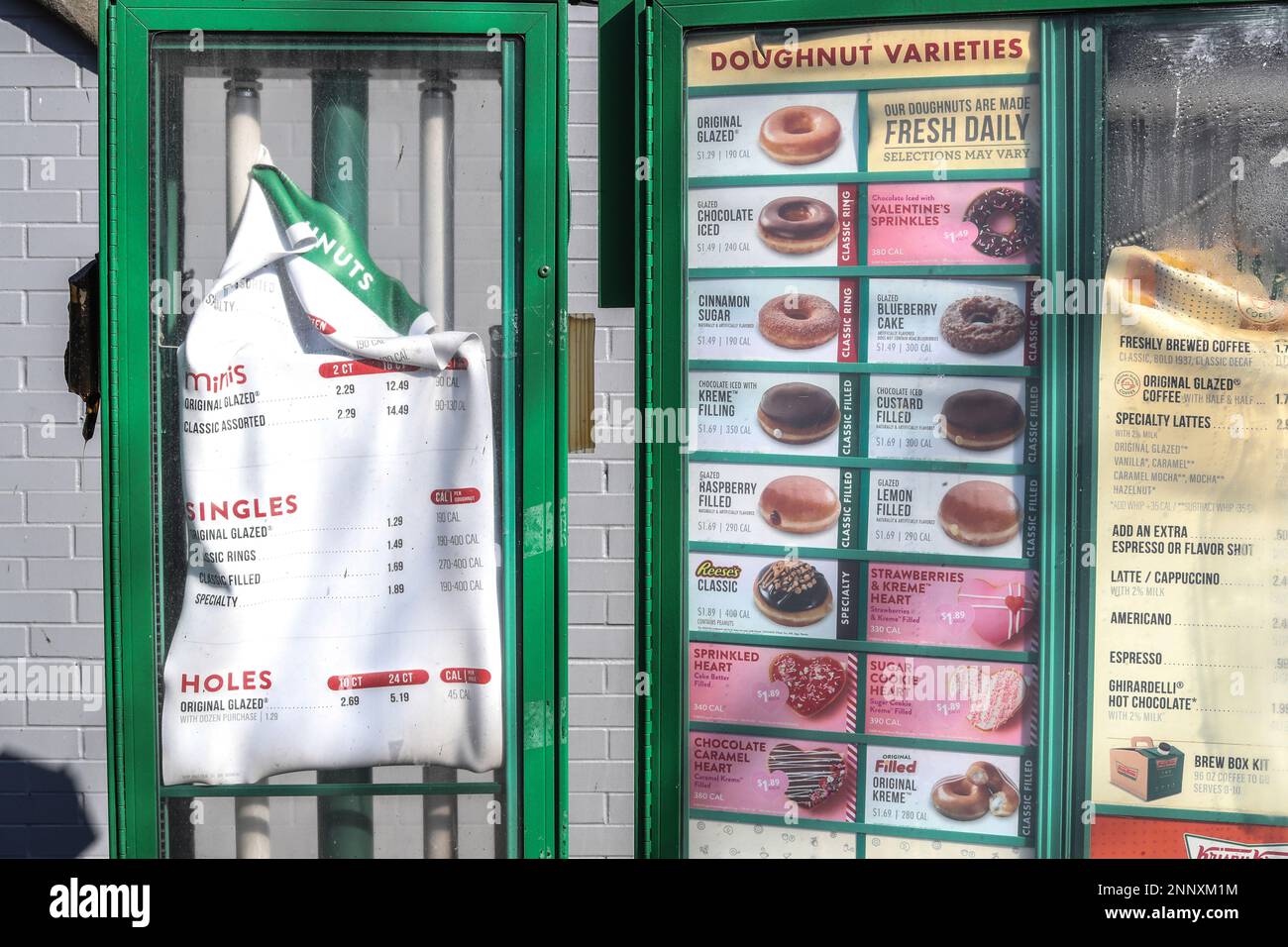 Damaged menu signs hang in the windows of the landmark Krispy Kreme ...