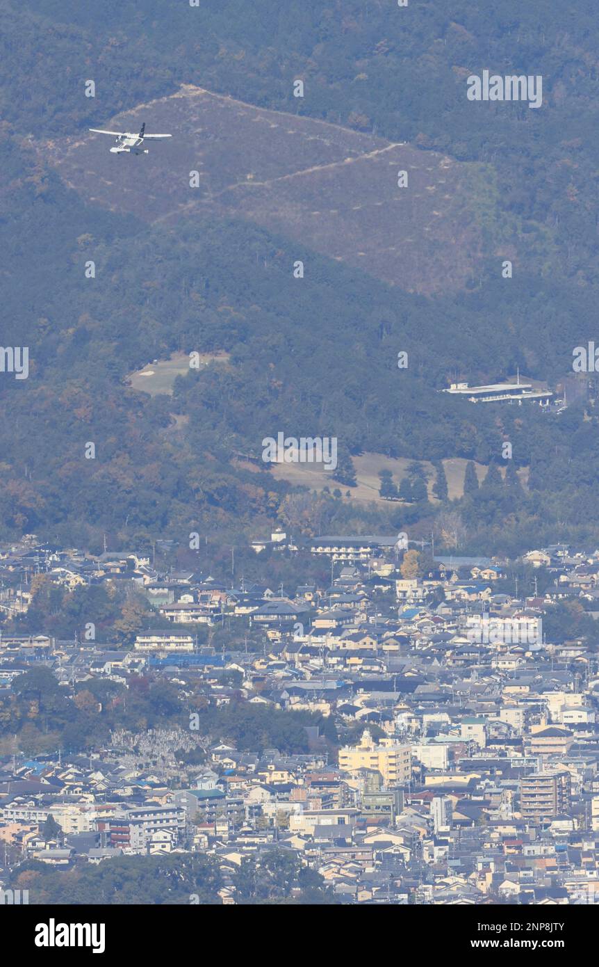 An aerial photo shows a seaplane flying over Biwa-ko Lake during its ...
