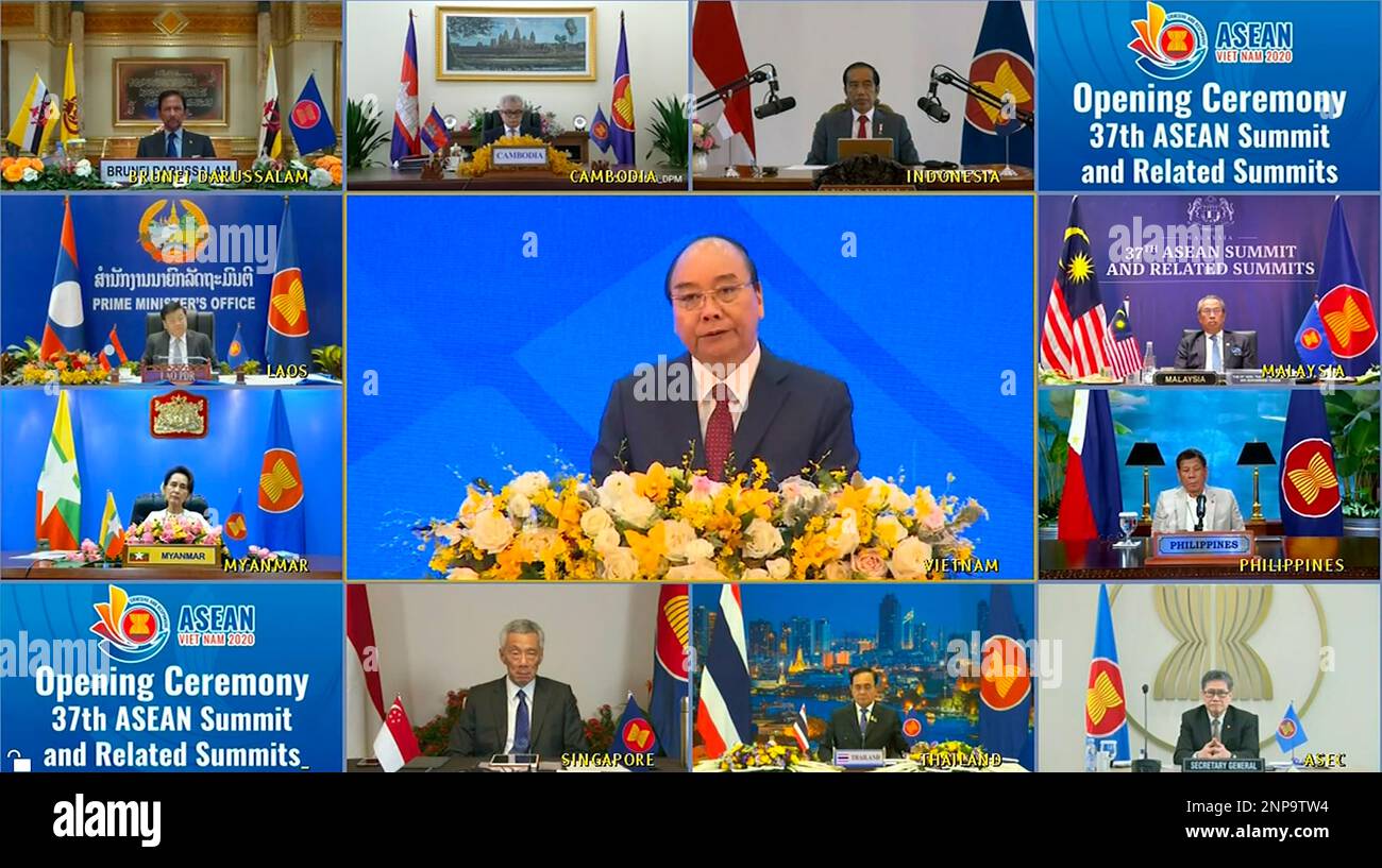 A screen shows ASEAN leaders attending an online summit, in Hanoi ...