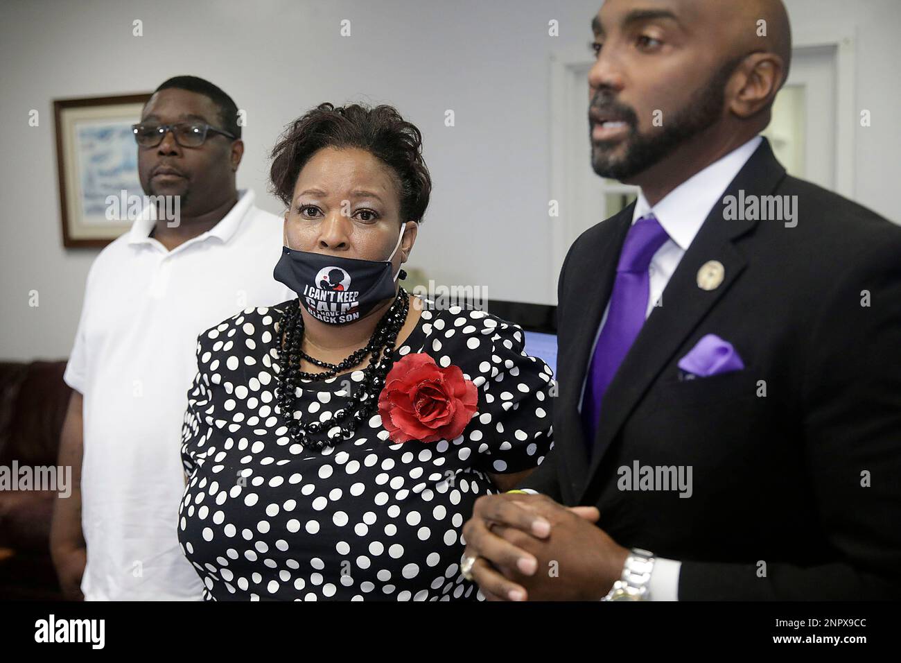 Roma Snowball-Presley listen as Attorney Damario Solomon-Simmons speaks ...