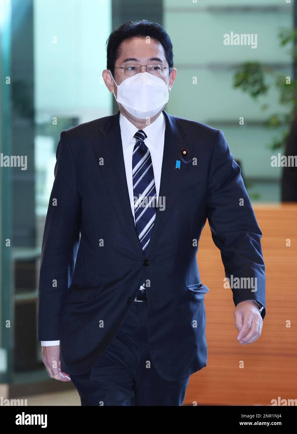 Japanese Prime Minister Fumio Kishida arrives at prime minister's office in Tokyo on February 27 ...