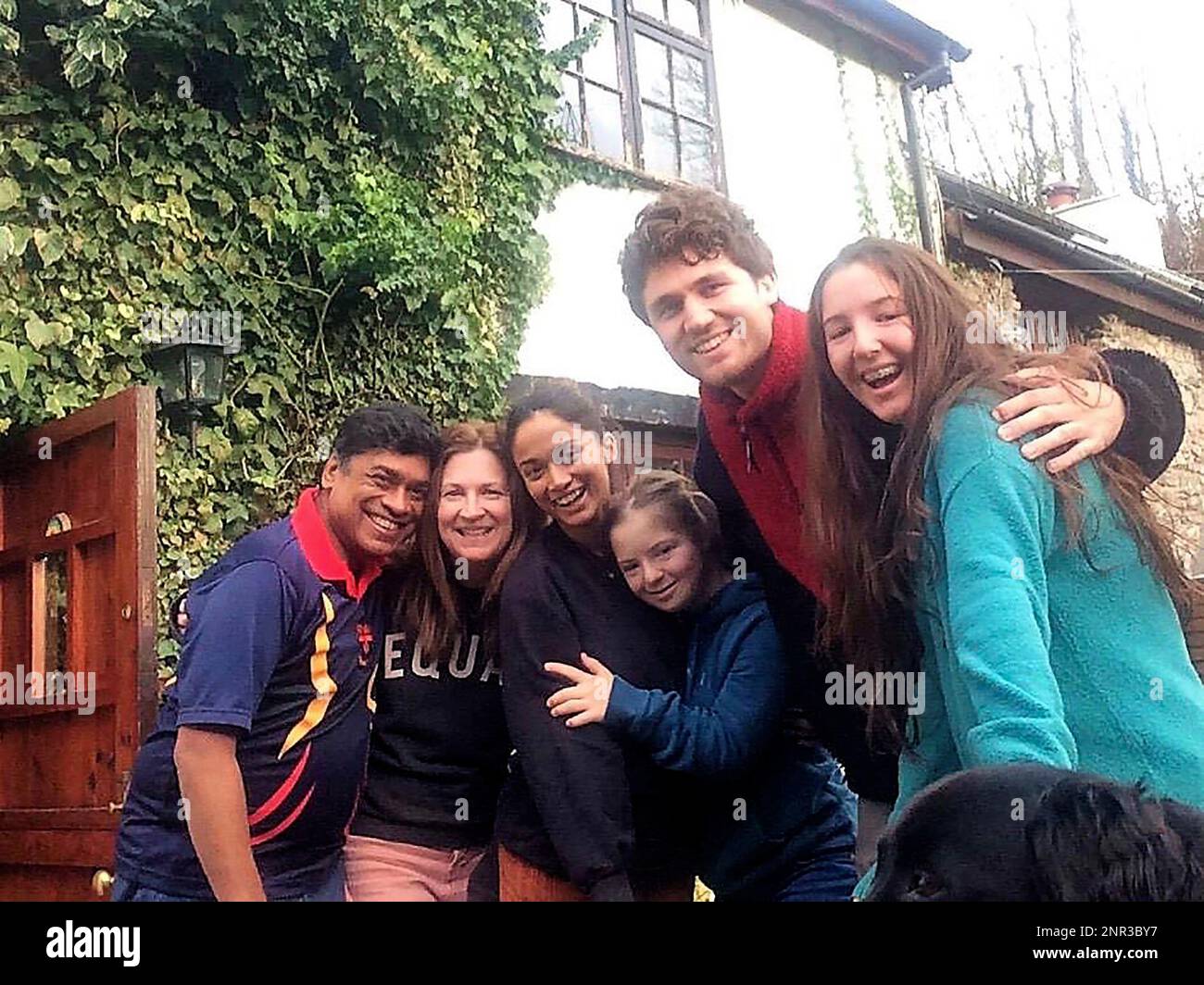 In this image taken in Oct. 2019 Dr. Poorna Gunasekera, left, poses for a photo with his family ...