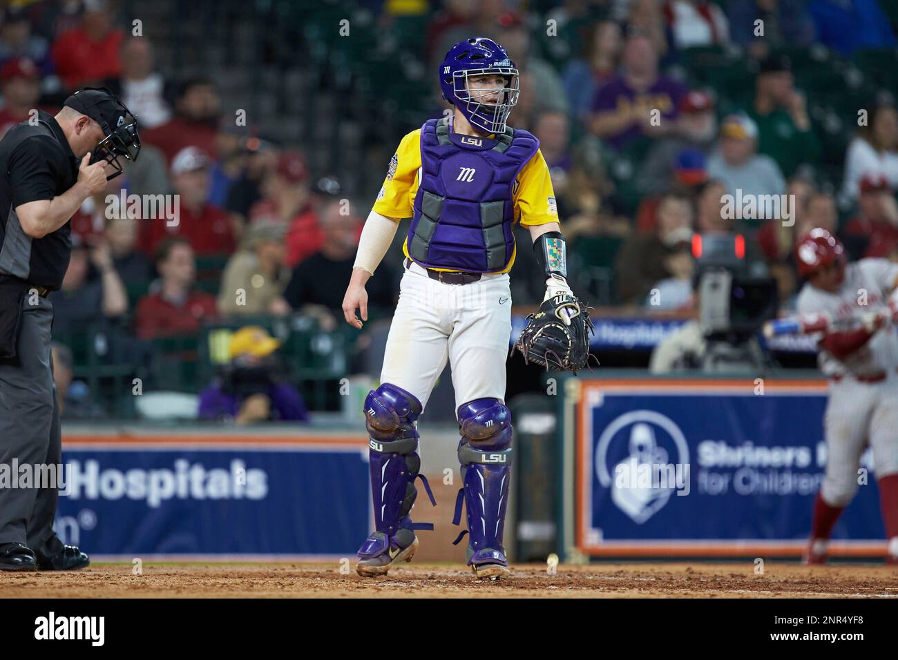 LSU Tigers catcher Alex Milazzo (20) on defense against the Oklahoma Sooners in game seven of ...
