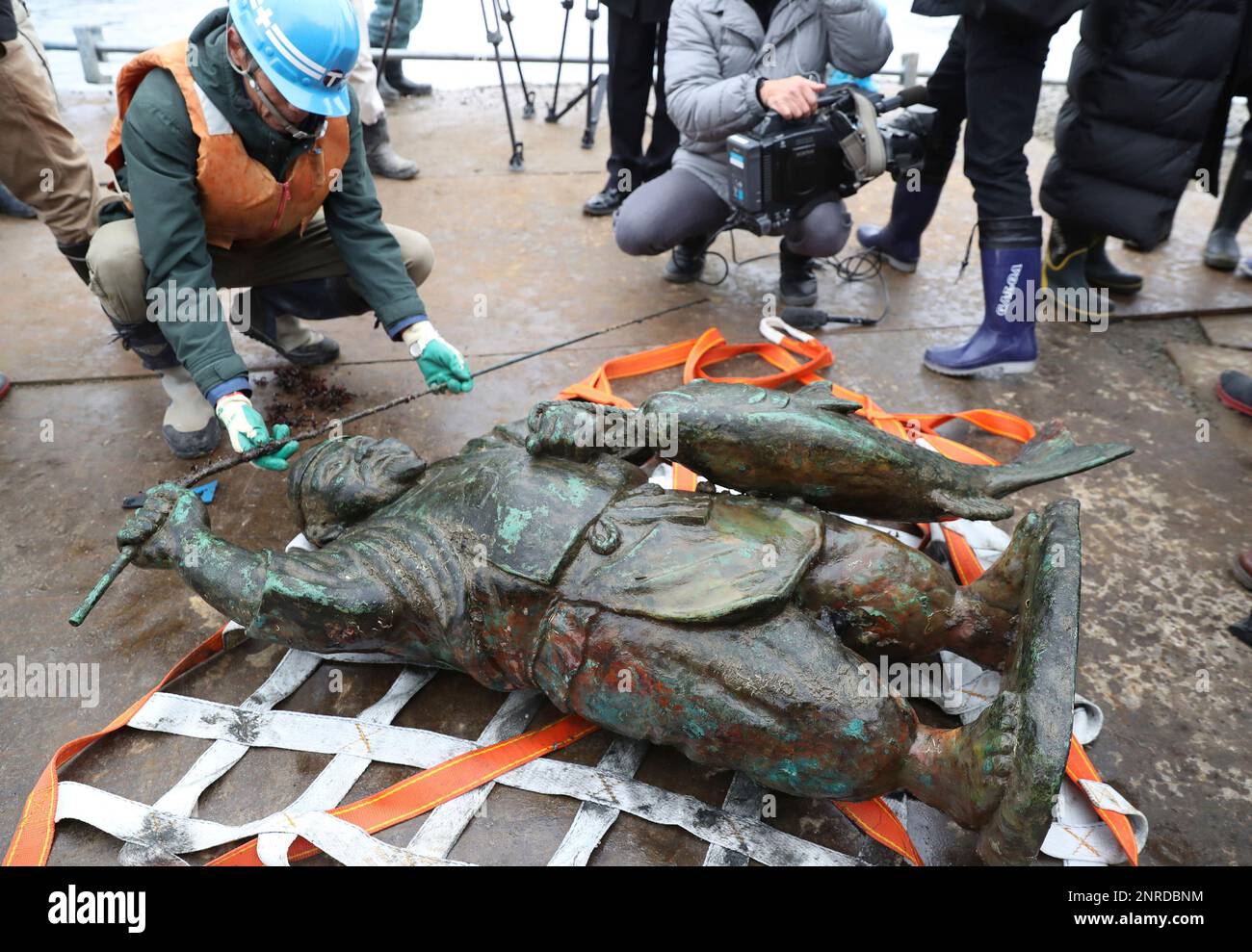 A Ebisu Statue, is raised from a sea bottom off Kesennuma Port in ...