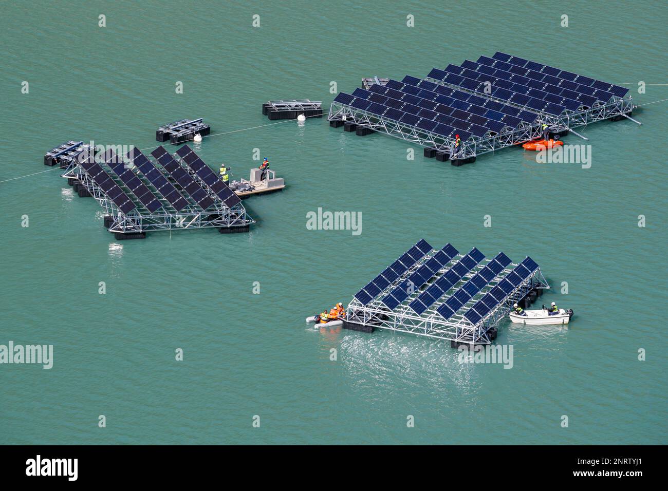 Floating barges with solar panels are pictured on the 'Lac des Toules ...
