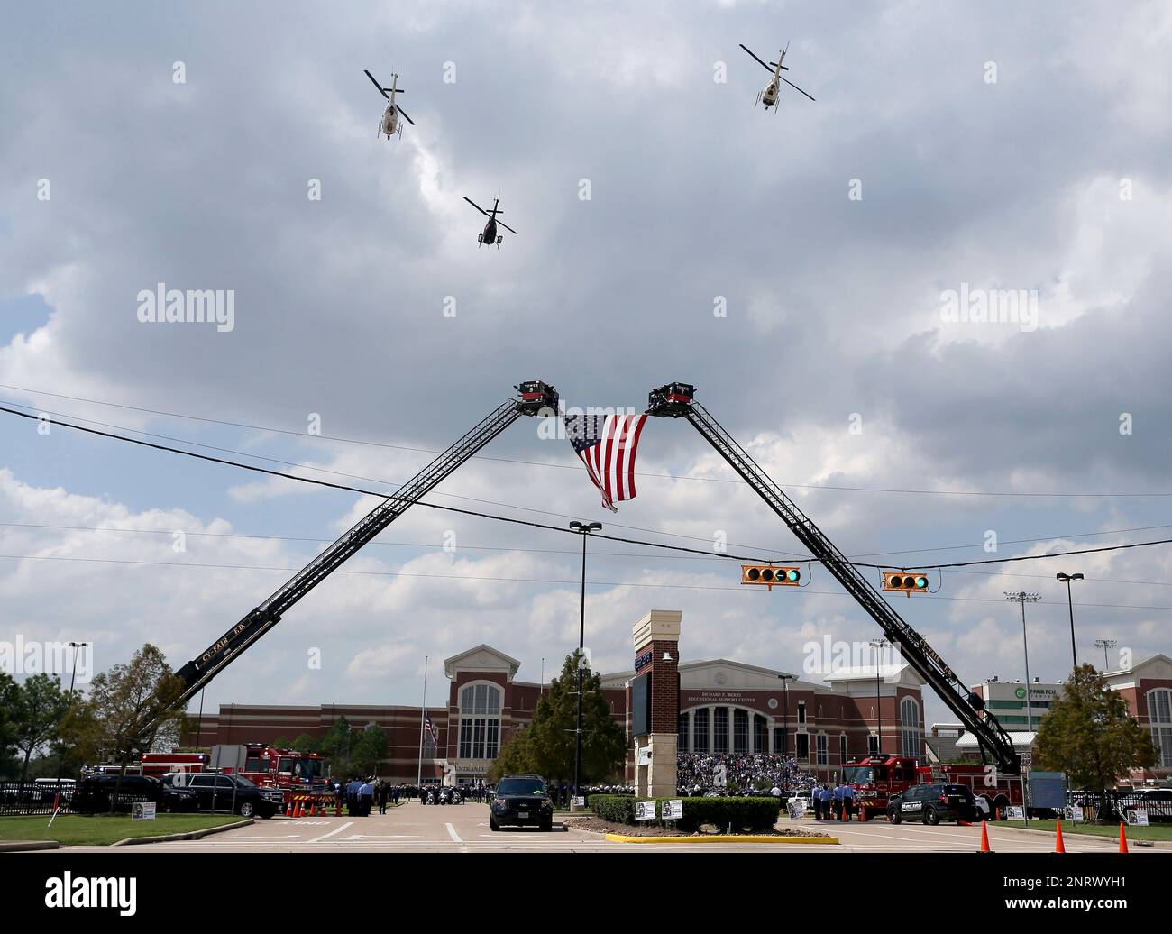 Three helicopters fly over the funeral for the fallen Harris County ...