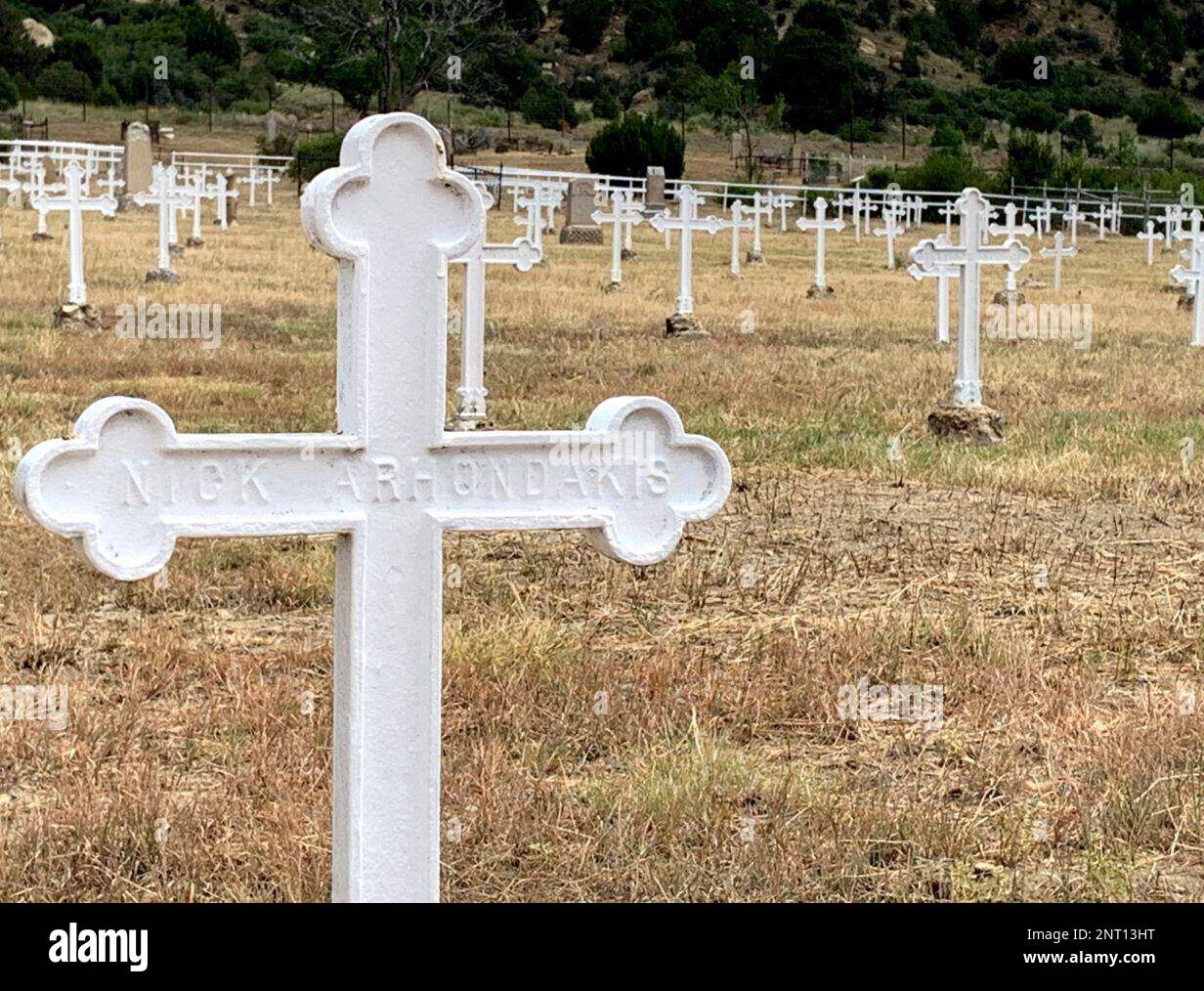 This Aug. 14, 2019 photo, shows a white iron cross bearing the name of ...
