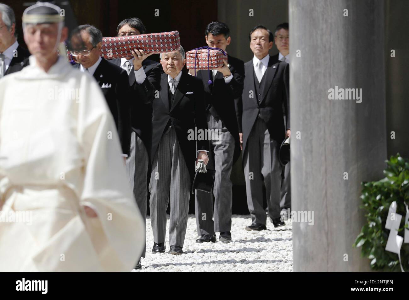 Japan's Emperor Akihito (5th from L) walks out after visiting ...