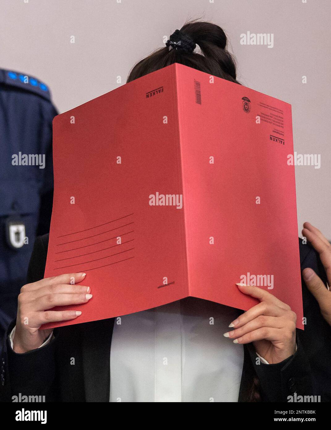 27-year-old German Jennifer W. covers her face as she arrives at a ...